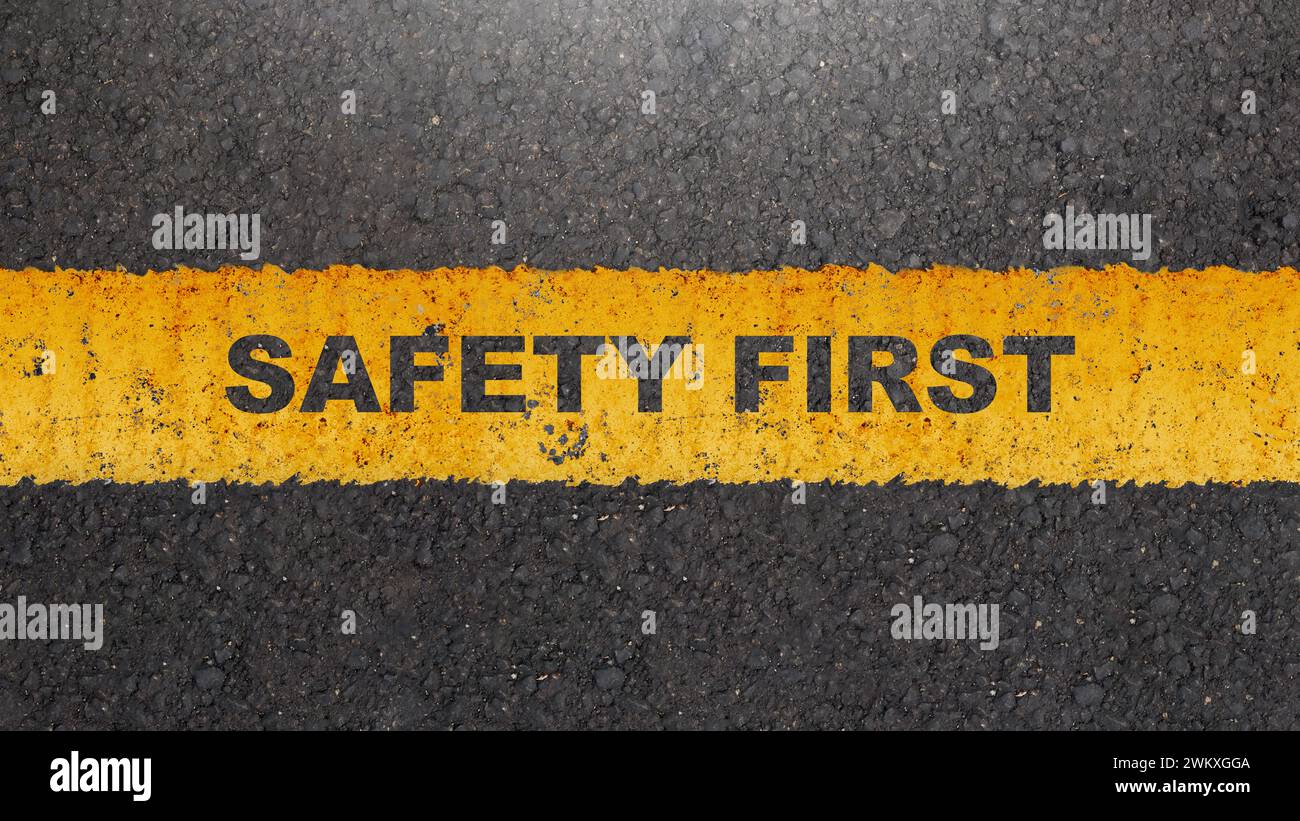 'Safety first' text on the asphalt road. Safety first concept Stock ...