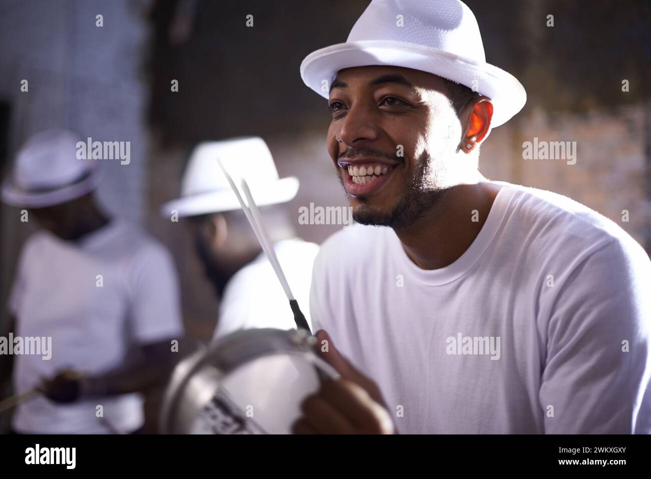 Live music, smile and man with percussion instrument and band mates on ...