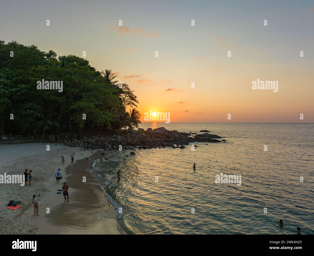 aerial view golden sky in sunset above the freedom beach Patong Phuket ...