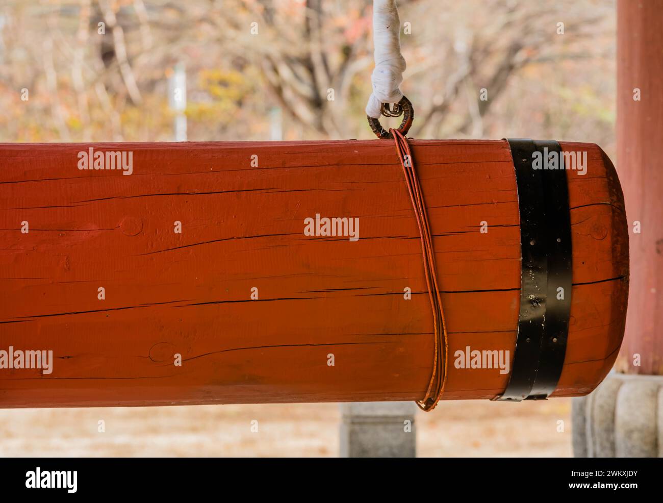 Closeup of large red wooden gong used at Buddhist temple to ring large ...