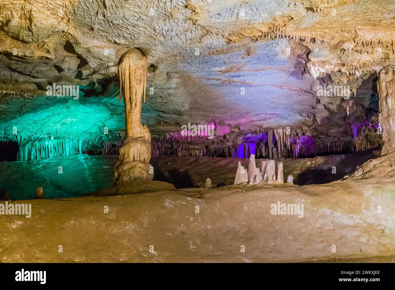 Stalactite and stalagmite formations in large opening in Cheongok cave ...