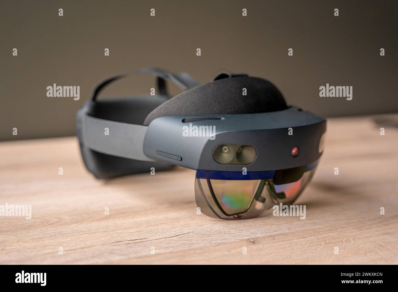 Futuristic wearable mixed reality goggles on a wooden table with no ...