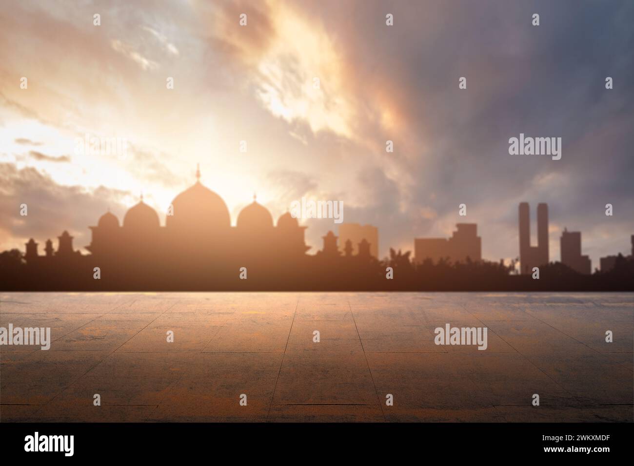 Outdoor floor with a view of a silhouette of the mosque with a dramatic ...