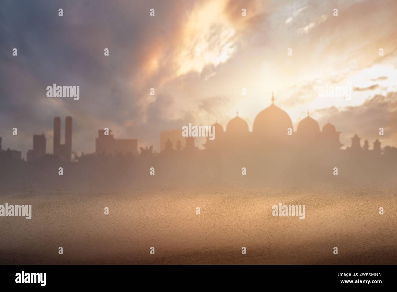 Desert with a view of a silhouette of the mosque with a dramatic sky ...
