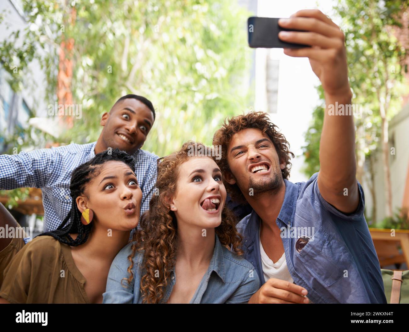 Funny, face and group of friends for selfie at university campus for ...