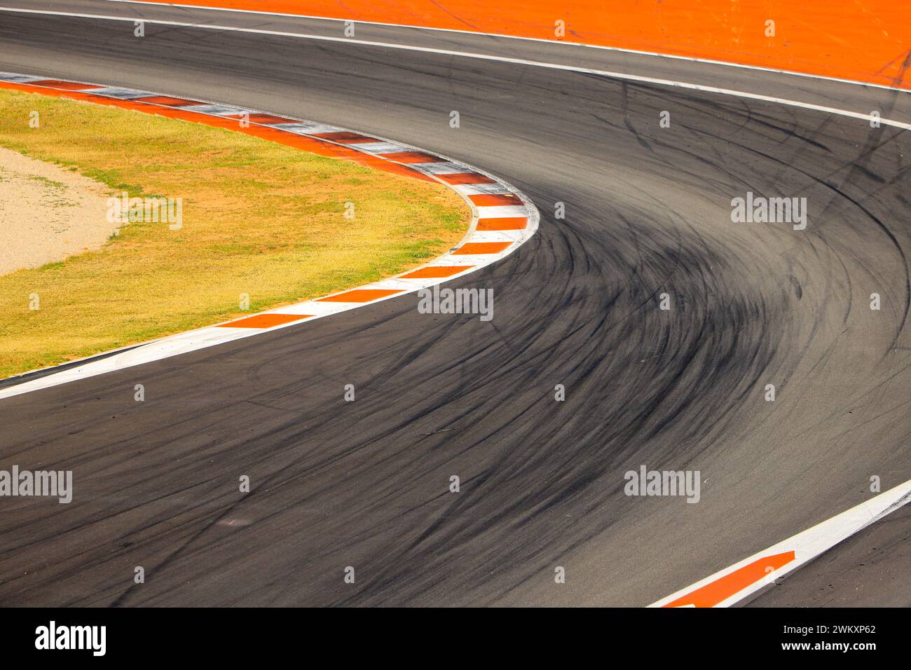 Race cars speeding around a track, with a central lane for passing ...