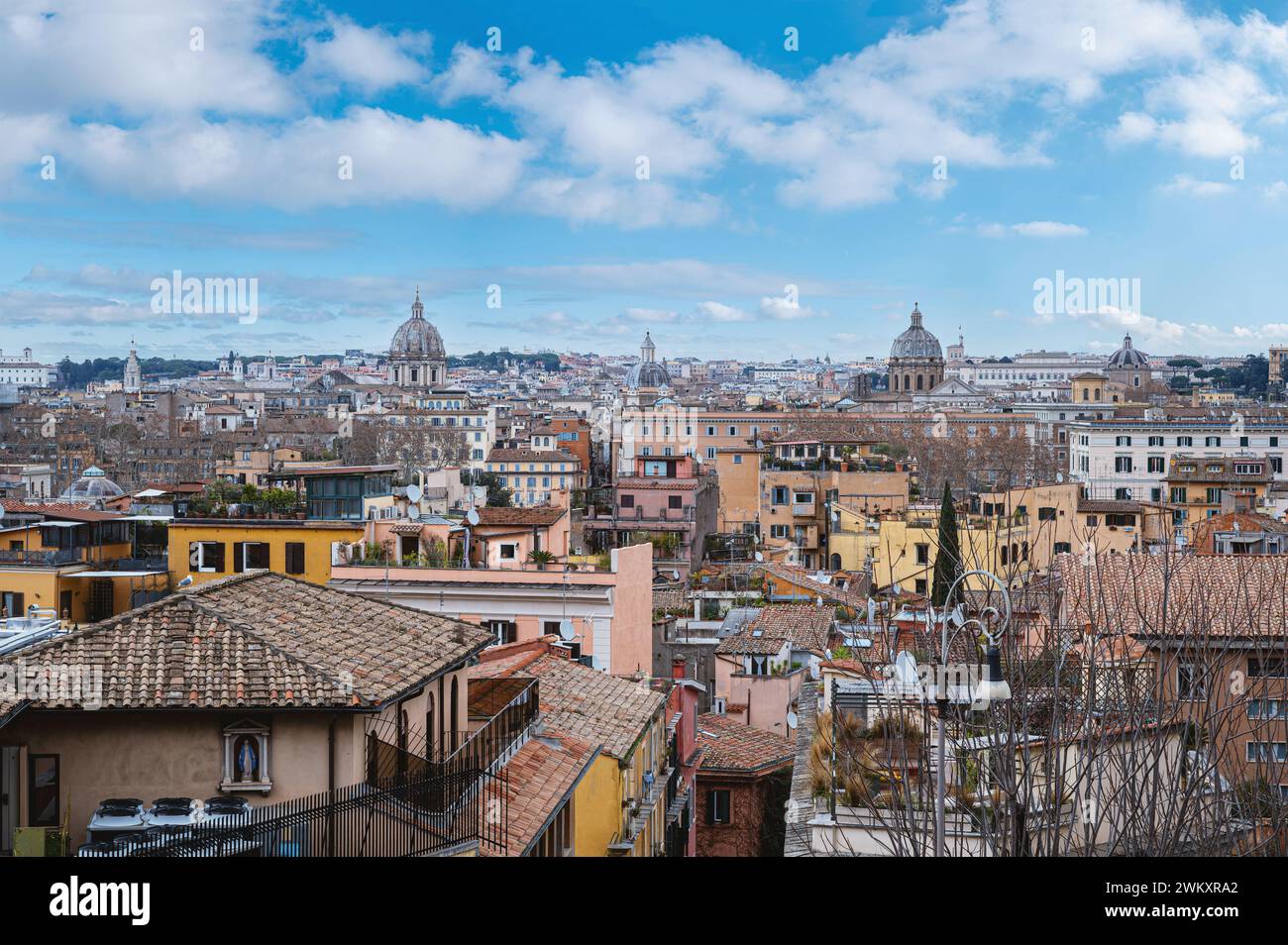 Aerial view of Rome against a blue sky, showcasing the city's majestic ...