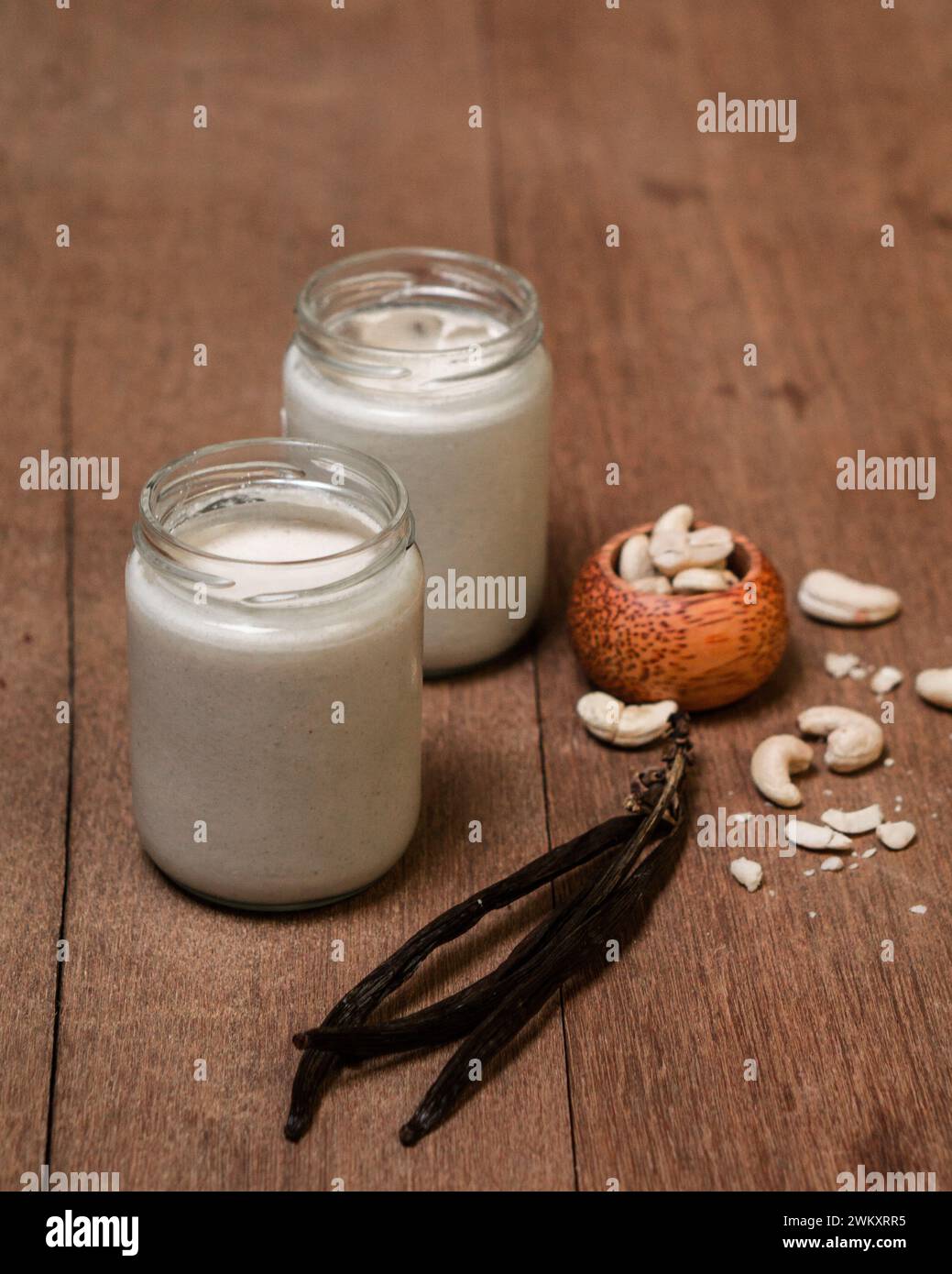 Rustic wood table displays a half-moon mozzarella and sunlight ...
