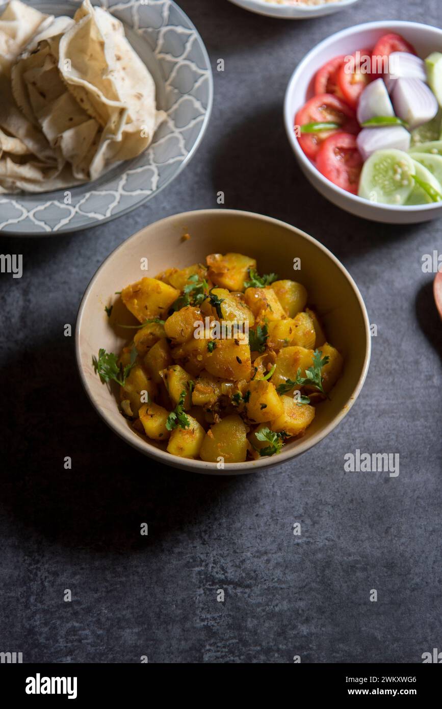 Indian dish aloo jeera or potato saute with cumin and coriander. Aloo ...