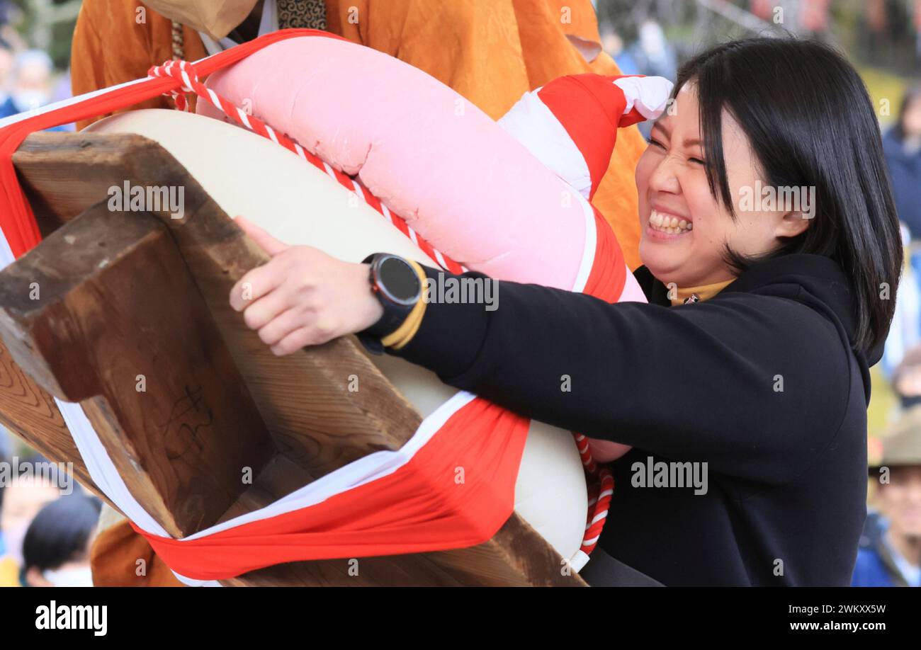 A participant in the women's section attempts to lift a huge, 90kg ...