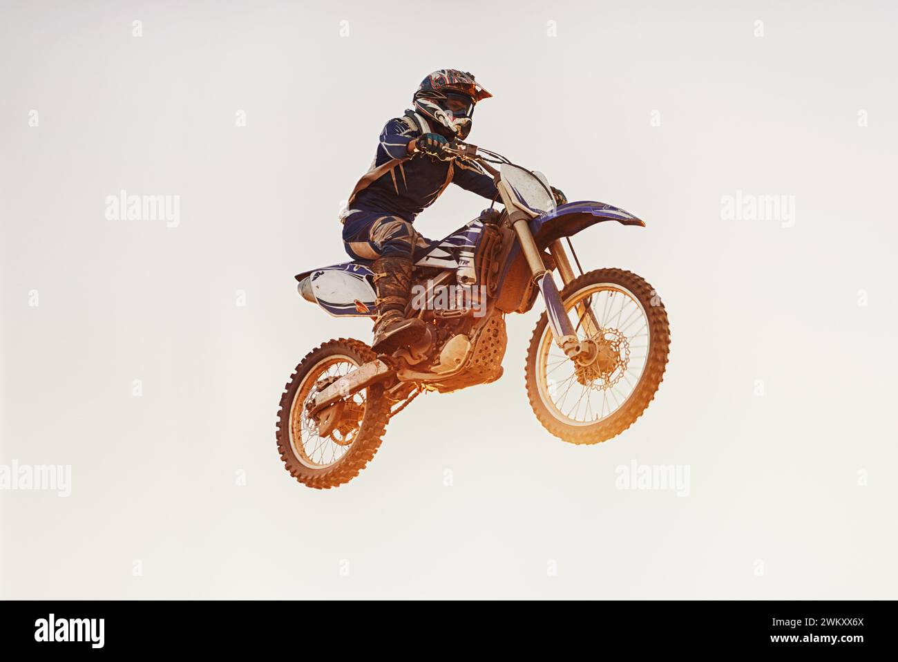 Person, jump and motorcyclist in the air for extreme sports, trick or ...