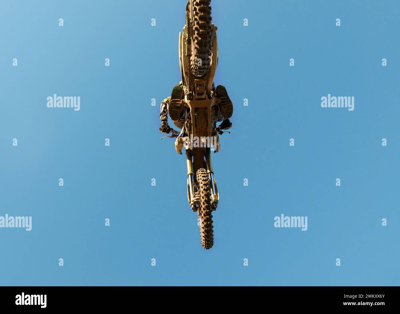 Motorcycle, jump and person on blue sky mockup with low angle for ...