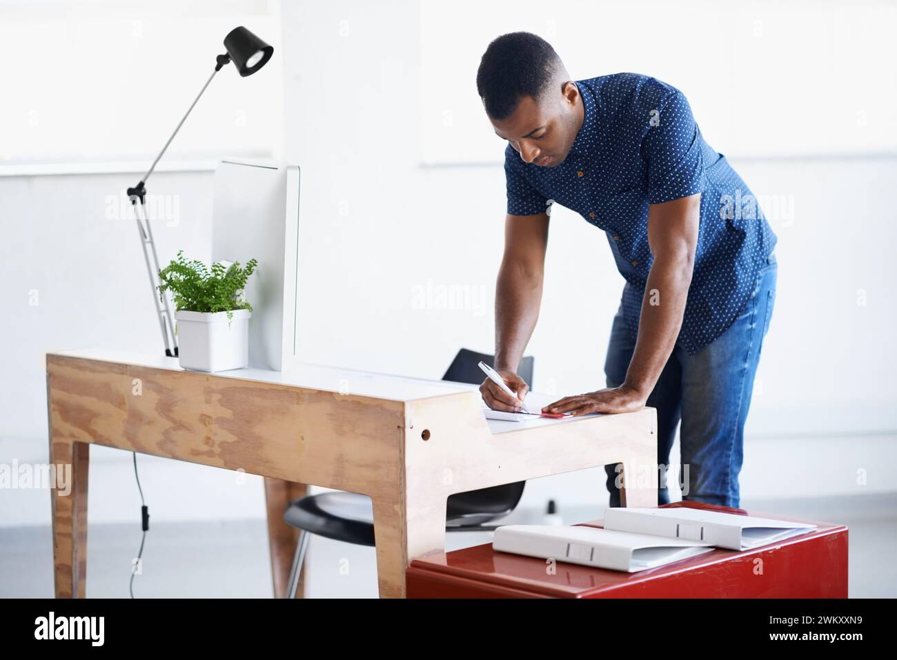 Business, graphic designer and black man with planning, writing and ...