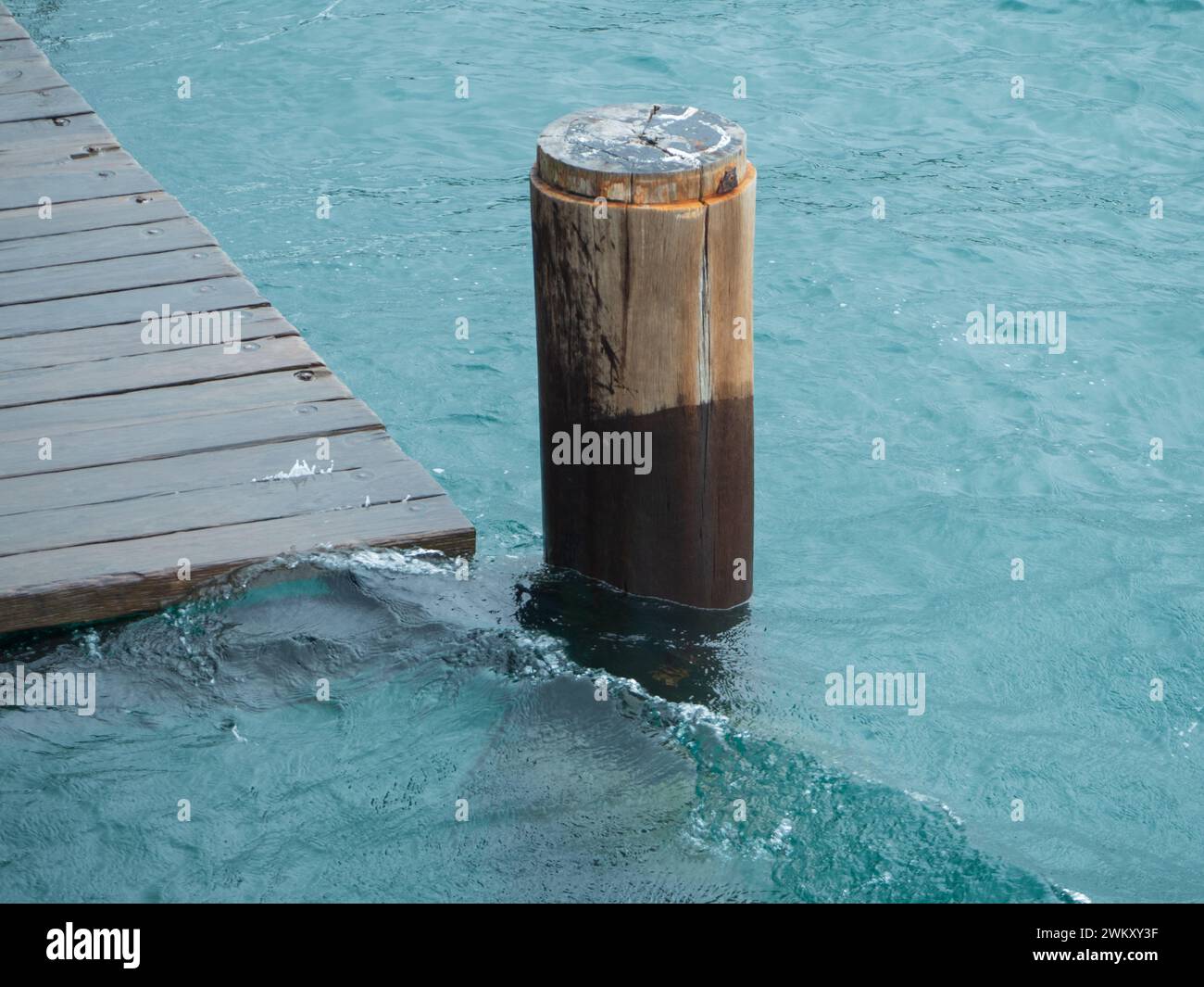 High Tide at the bottom platform of the Jetty Pier, blue sea water ...