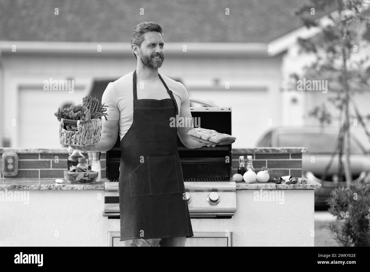 bbq man with salmon fish in apron, banner. photo of bbq man with salmon ...