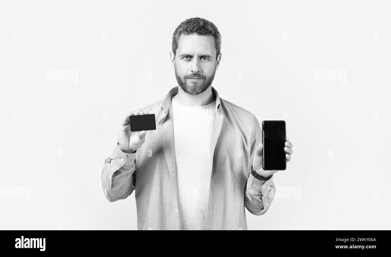 man paying transaction isolated on studio background. man paying ...