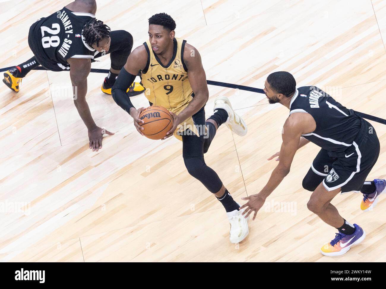 Toronto, Canada. 22nd Feb, 2024. RJ Barrett (C) of Toronto Raptors breaks through during the ...