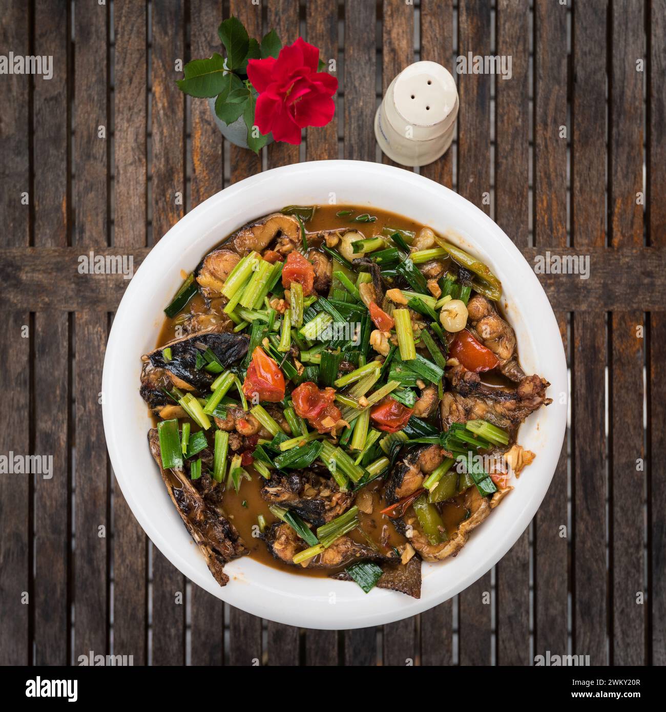 Stir-Fried Catfish with Tomatoin in Chinese Dish Stock Photo - Alamy