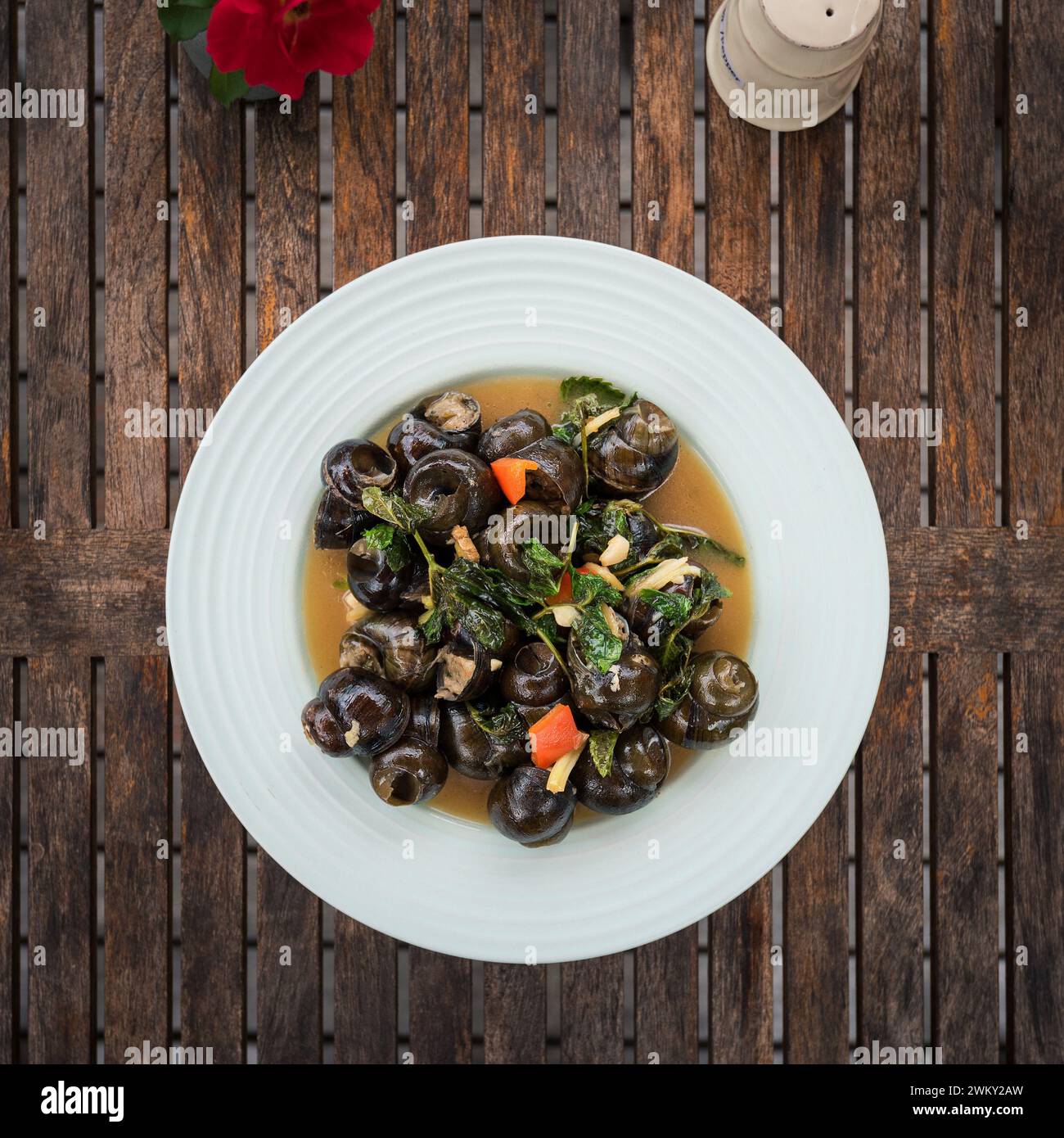 Stuffed Snails with Vanilla in Chinese Dish Stock Photo - Alamy