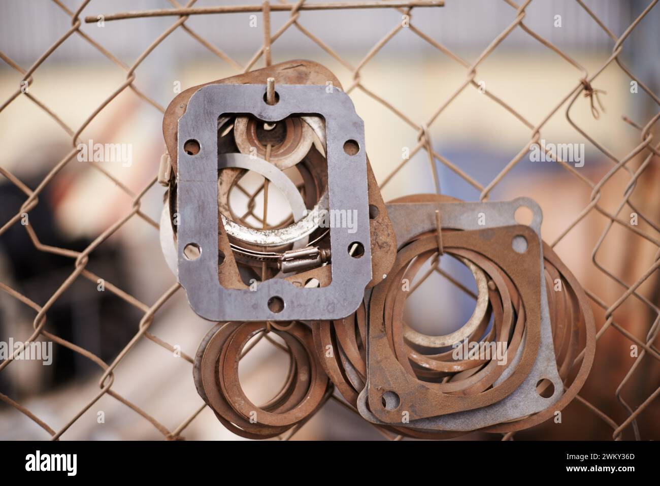 Fence, car gasket throttle and engineering in a scrap yard and mechanic ...
