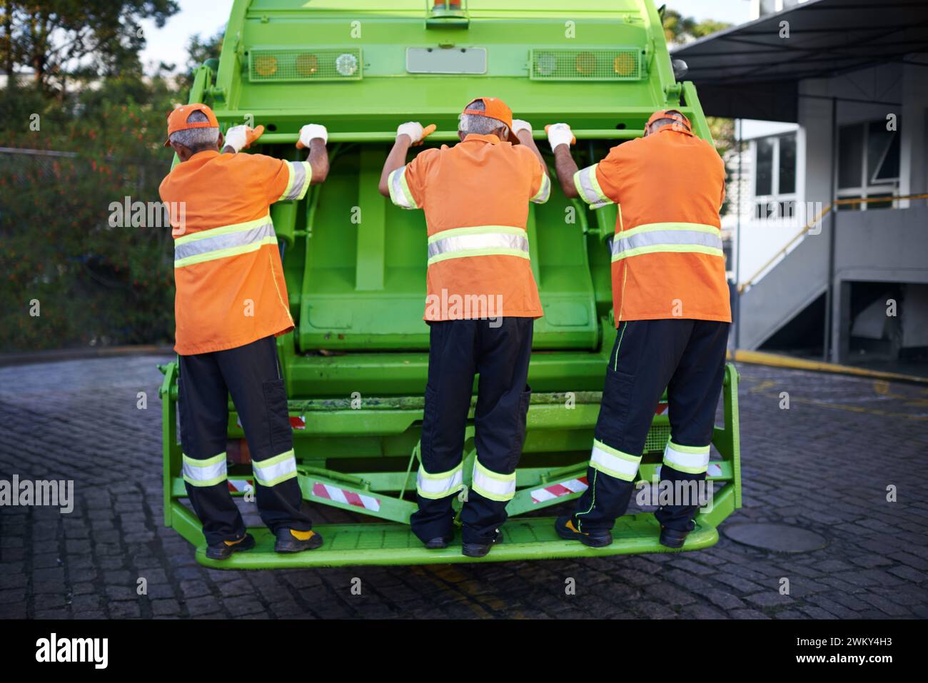 Men, garbage truck and waste collection service for city pollution for ...