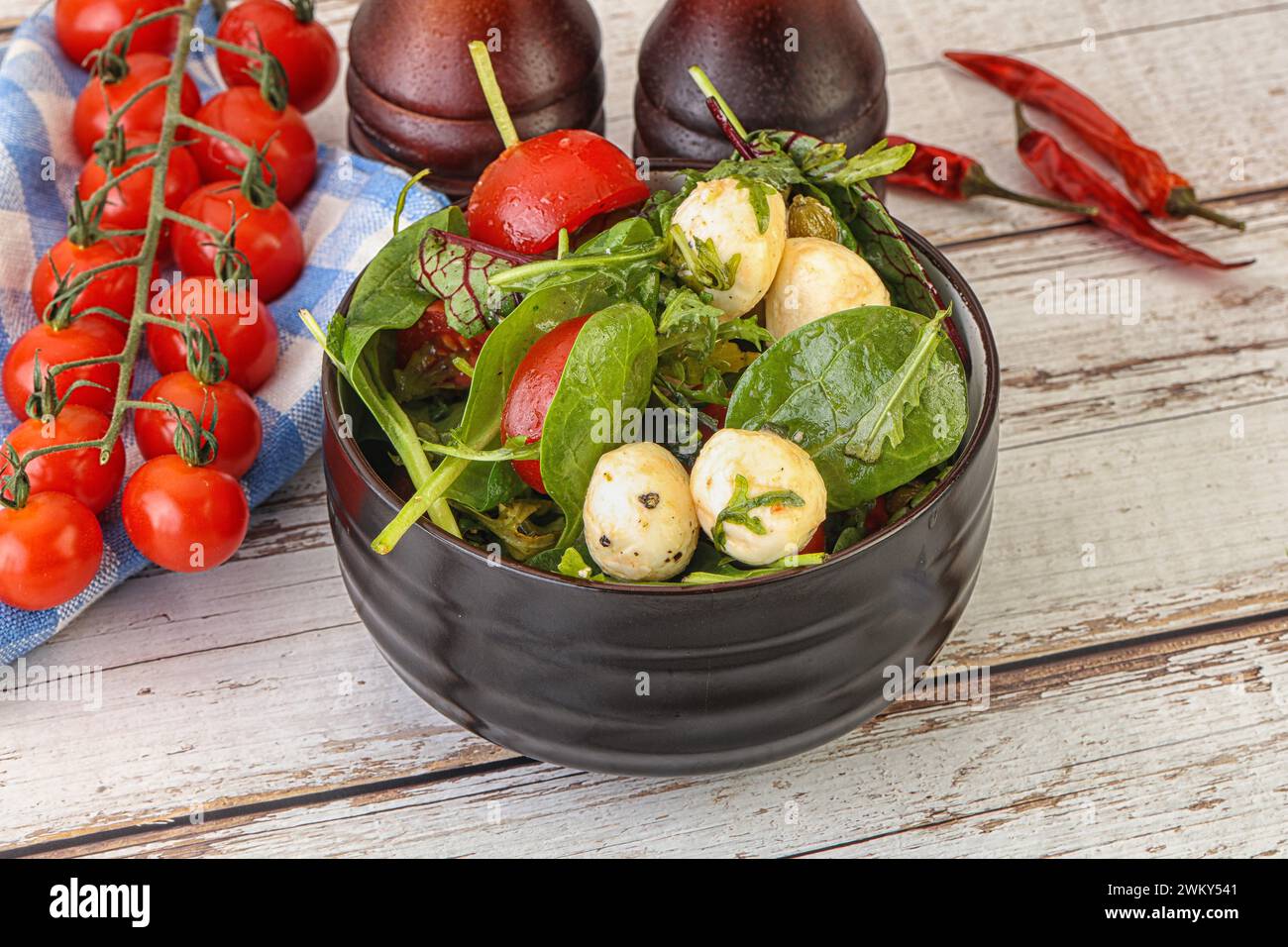 Mix salad with mini mozzarella and tomato Stock Photo - Alamy