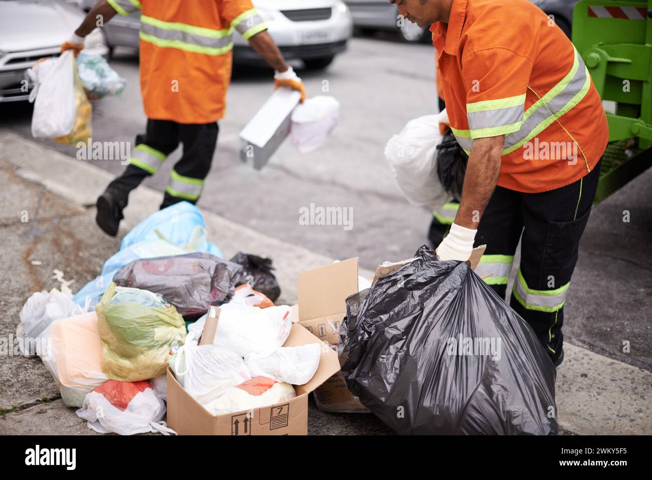 Worker, street and bag of trash in city for cleaning, recycling and ...