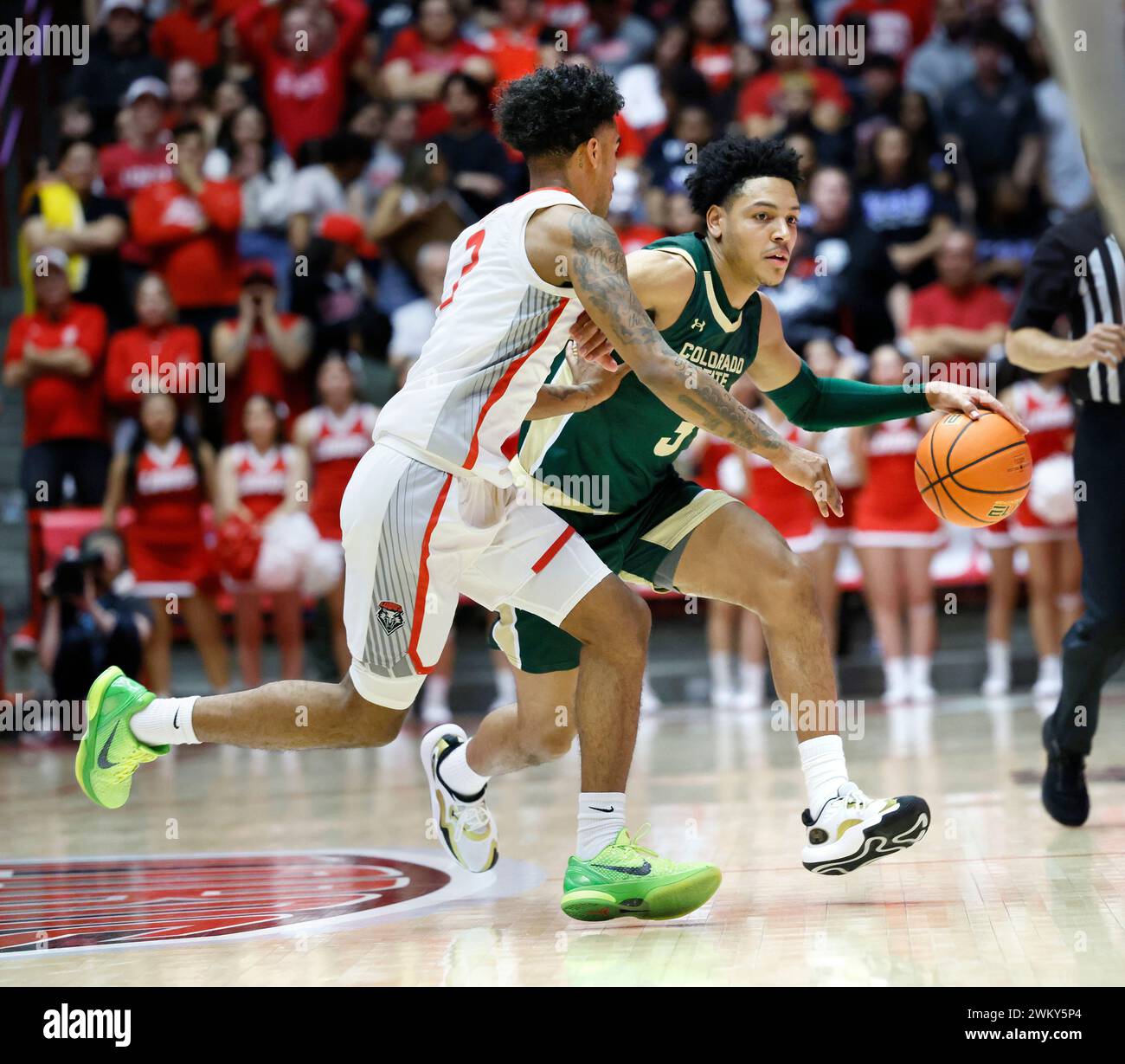 Colorado State guard Josiah Strong dribbles past New Mexico guard ...
