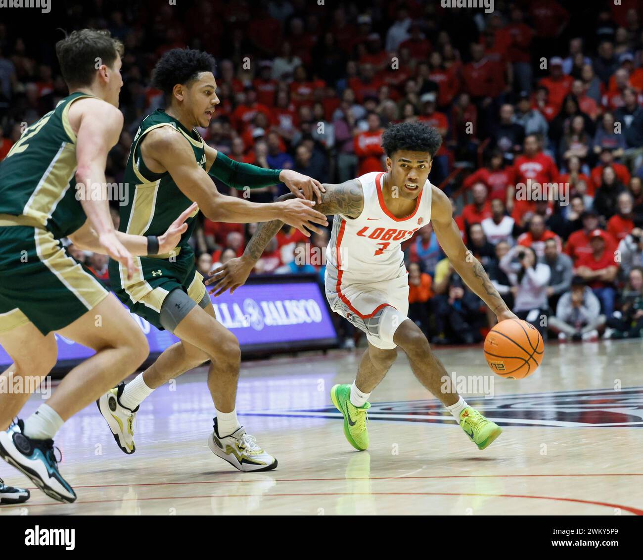 New Mexico guard Donovan Dent dribbles past Colorado State's Josiah ...