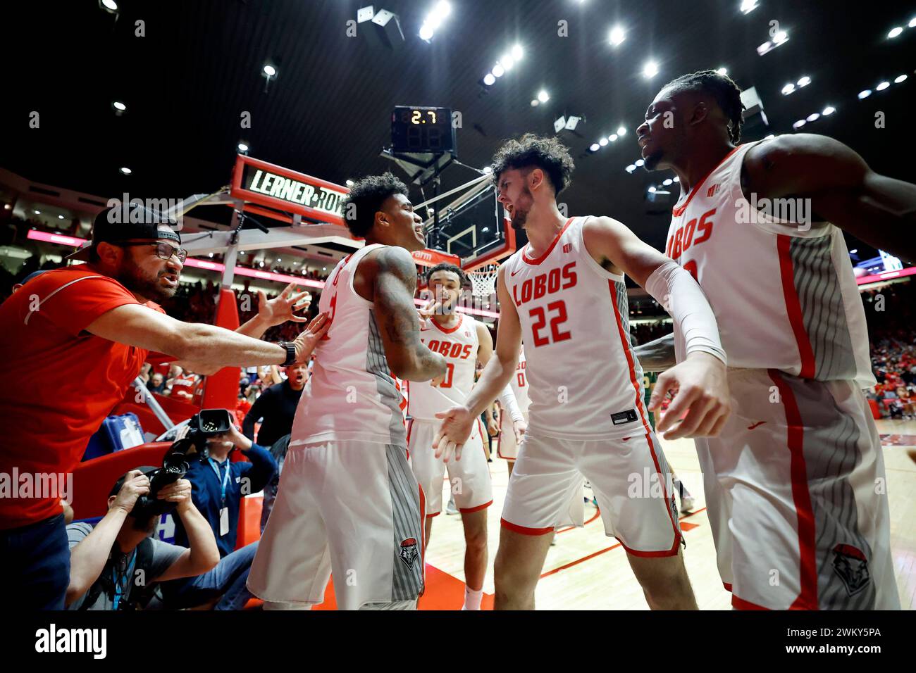 New Mexico guard Donovan Dent, left, celebrates with teammates after ...