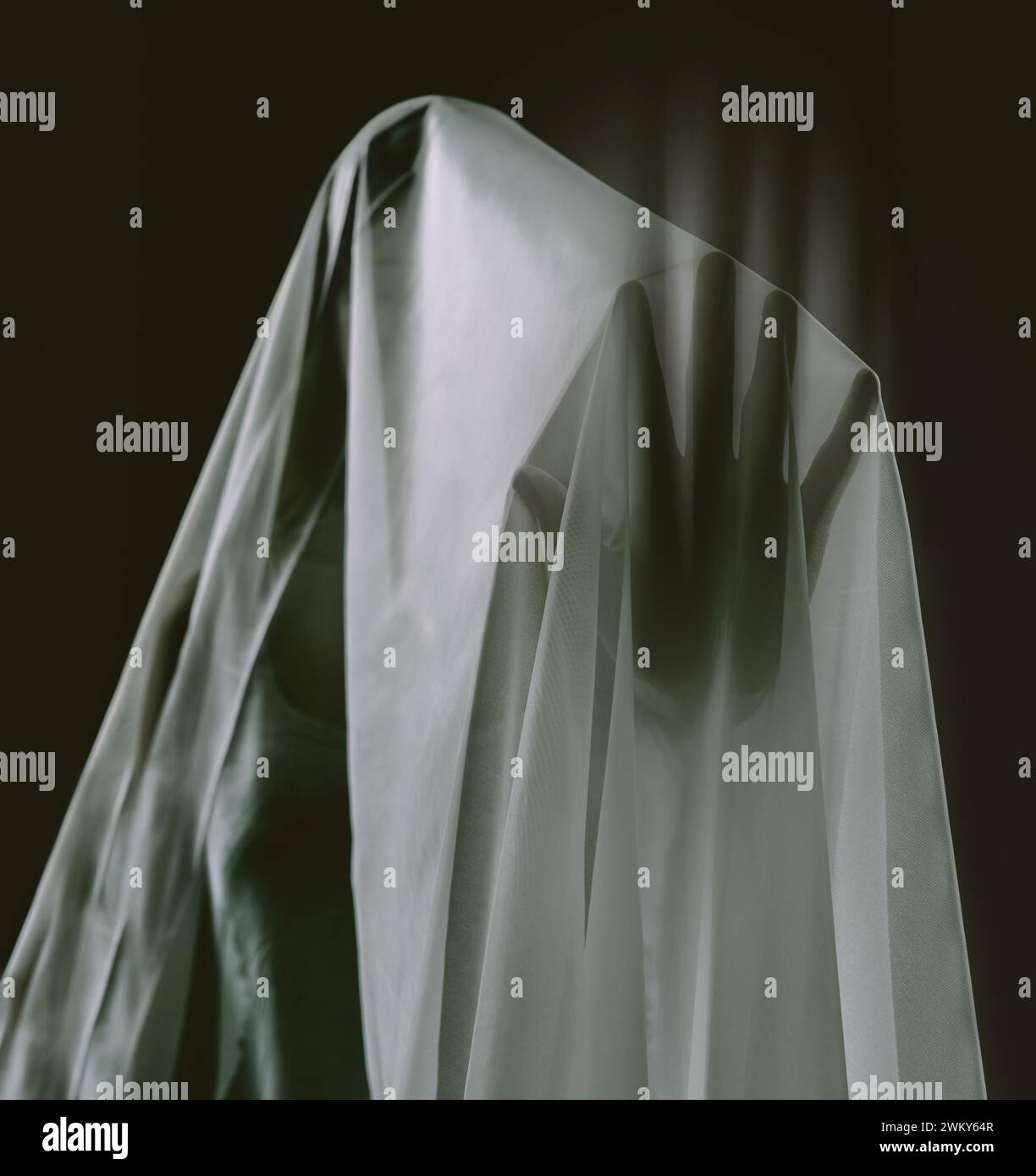 Horror, dark and scary ghost in sheet on black background with haunting ...