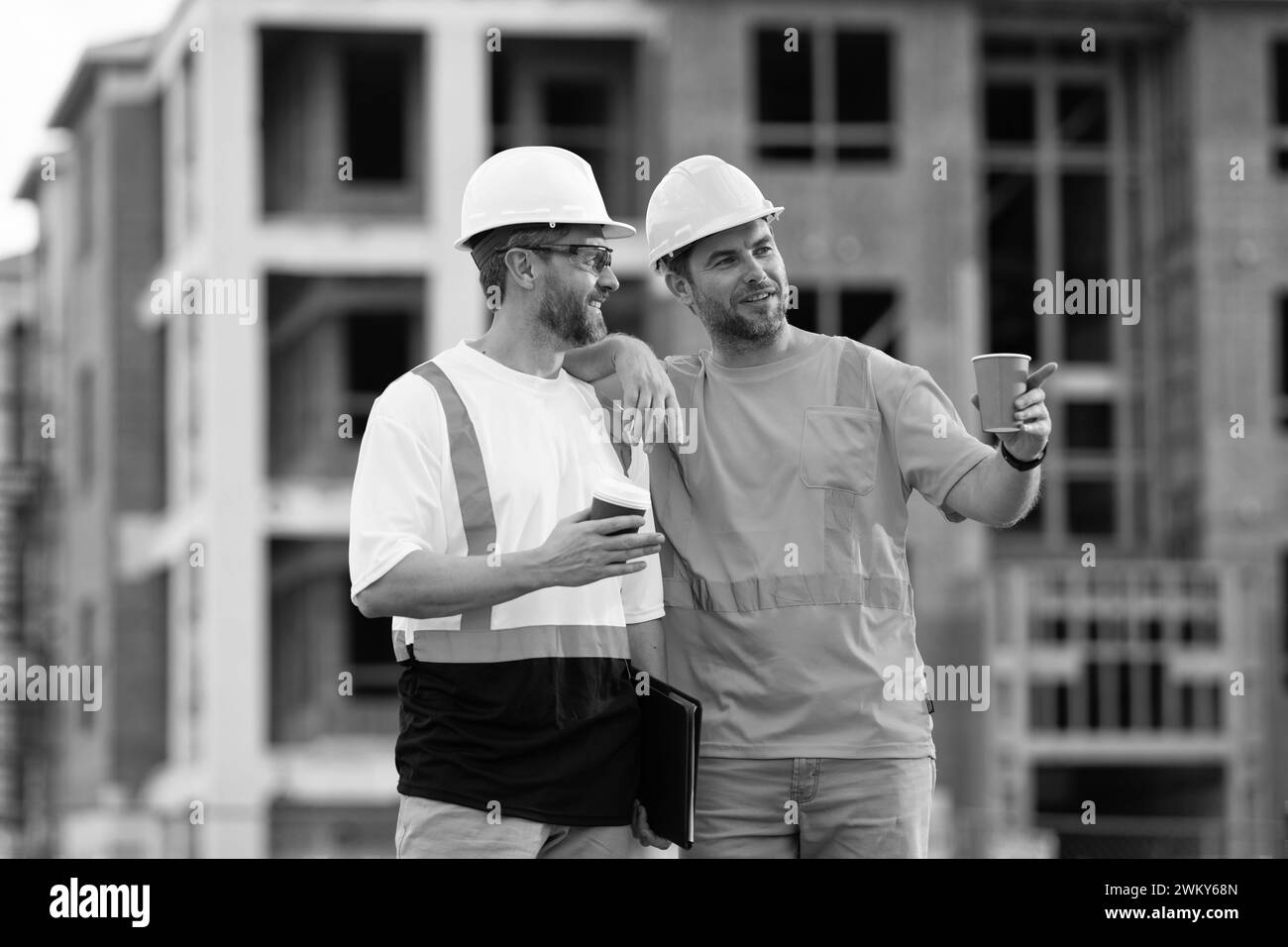 two engineer men at construction site wearing hardhat outdoor Stock ...