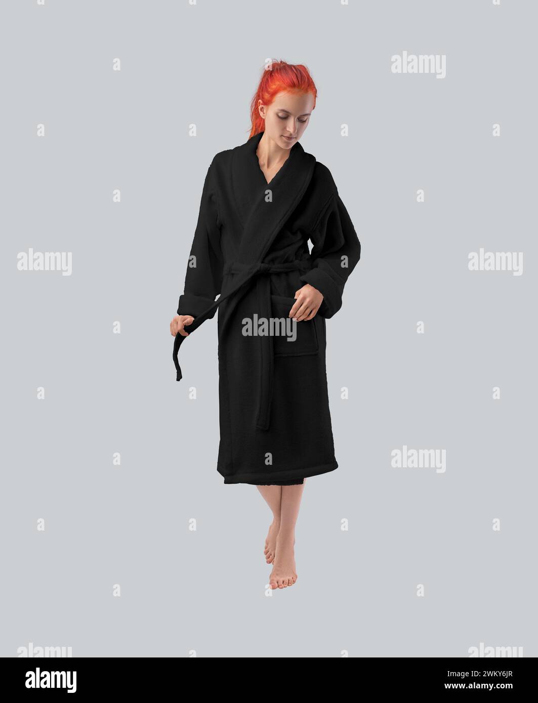 Mockup of a black terry bathrobe with a belt, a winter robe with rolled ...