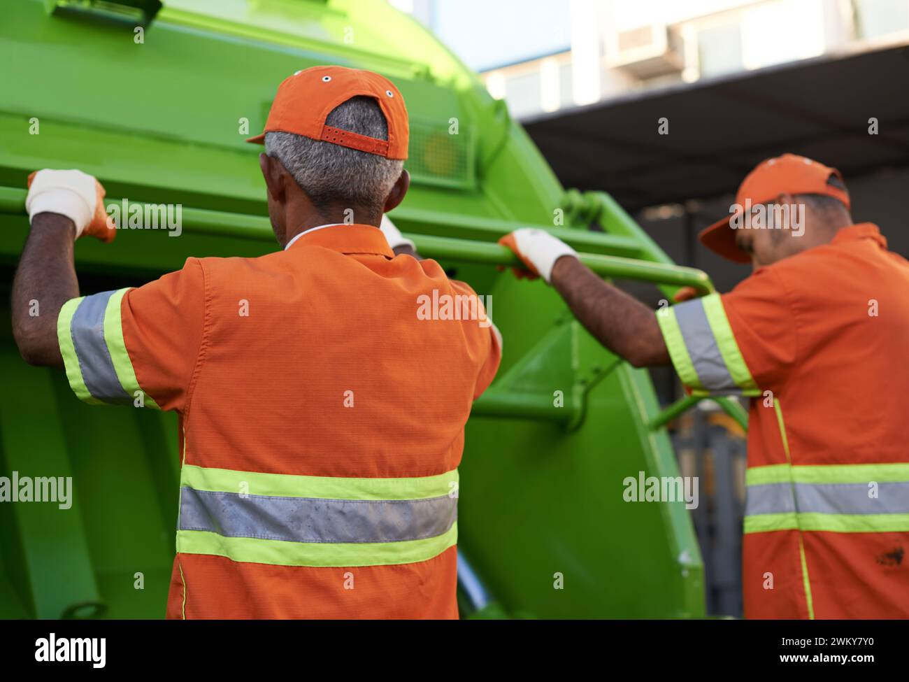 Garbage collector, men and truck for waste management and teamwork with ...