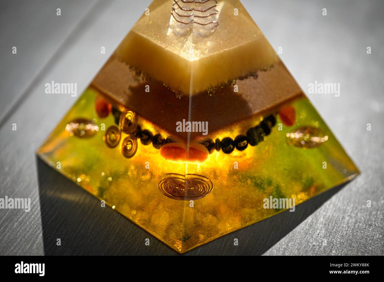 Isolated close up of three beautiful blue orgone generator pyramids ...
