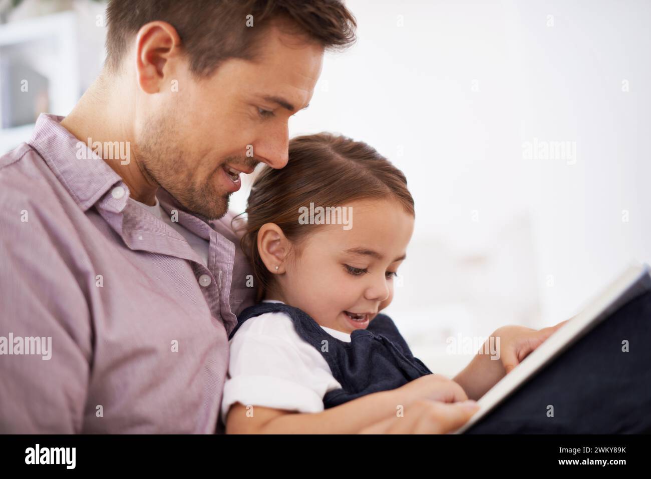 Father, kid with book for reading and storytelling, happy with bonding ...