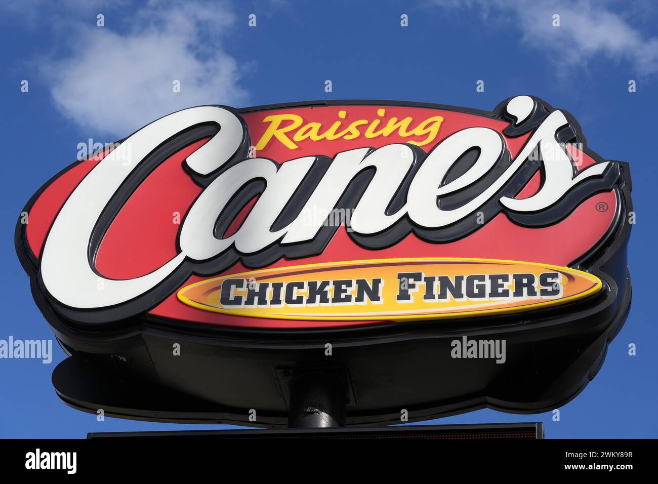 A Raising Cane's chicken fingers fast food restaurant sign, Thursday ...