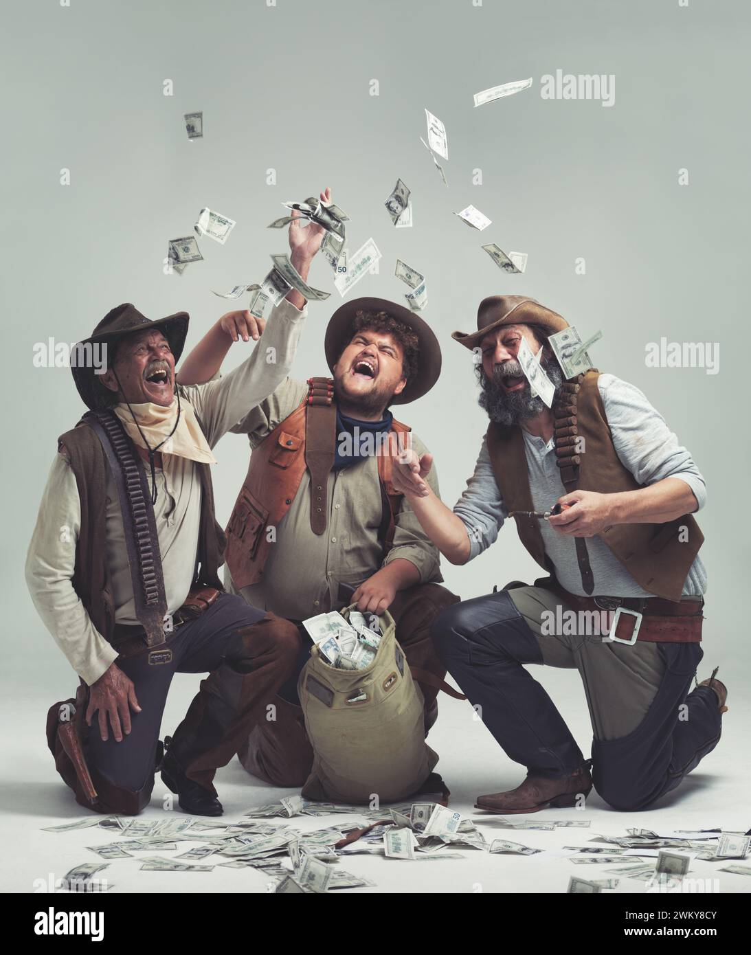 Money, thief and western with celebration of people in studio on gray ...