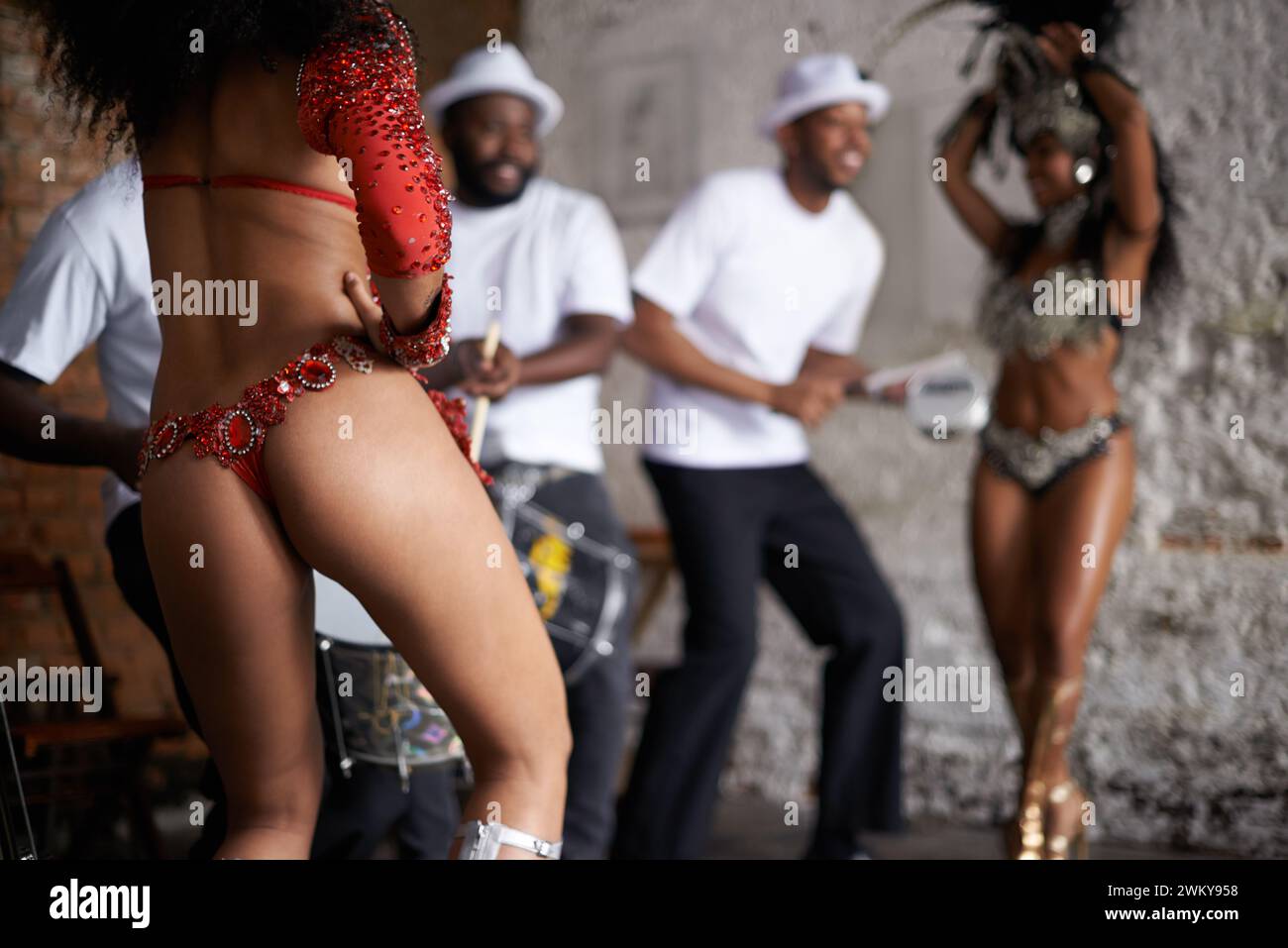 Woman, carnival and samba dancer with band for performance at outdoor festival in traditional ...