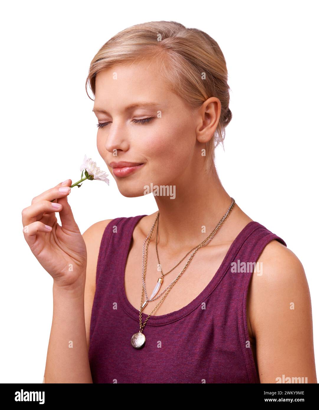 Studio, woman and smelling a daisy by white background and scent of ...