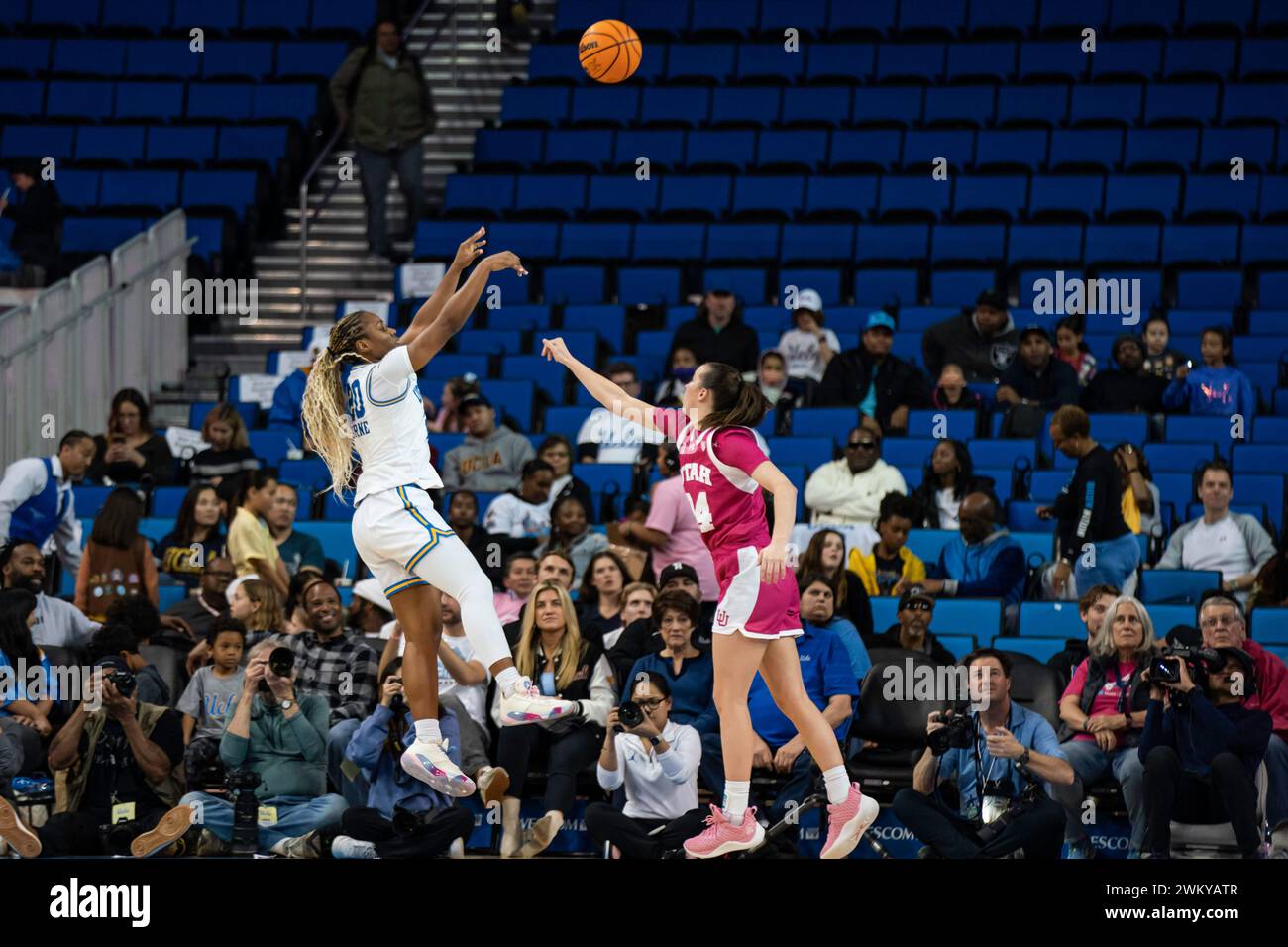 UCLA Bruins guard Charisma Osborne (20) shoots over Utah Utes guard ...