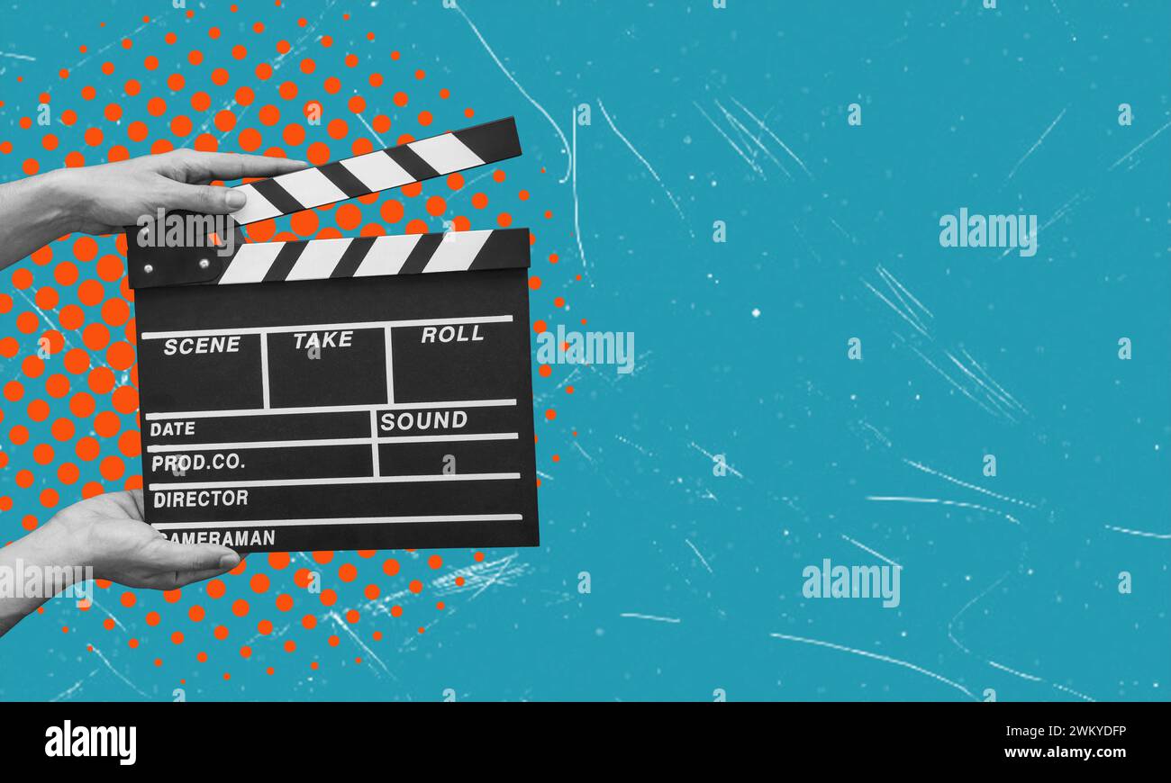 Hands holding a clapper, filming a video movie in a studio. Movie ...