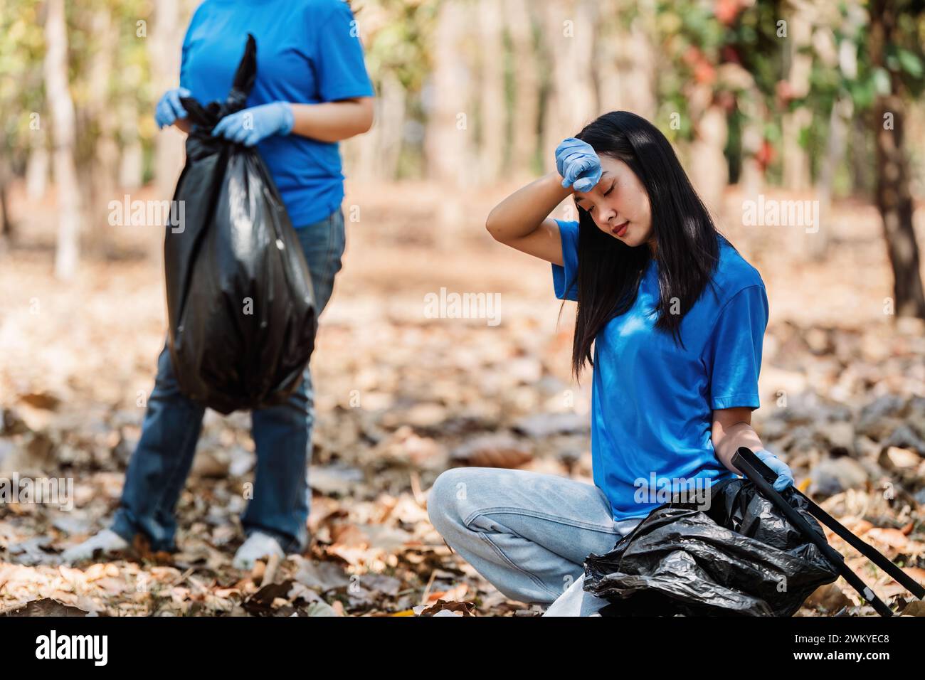 Group of volunteers, community members cleaning the nature from garbage ...