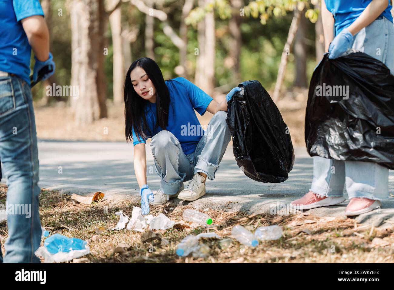 Group of volunteers, community members cleaning the nature from garbage ...
