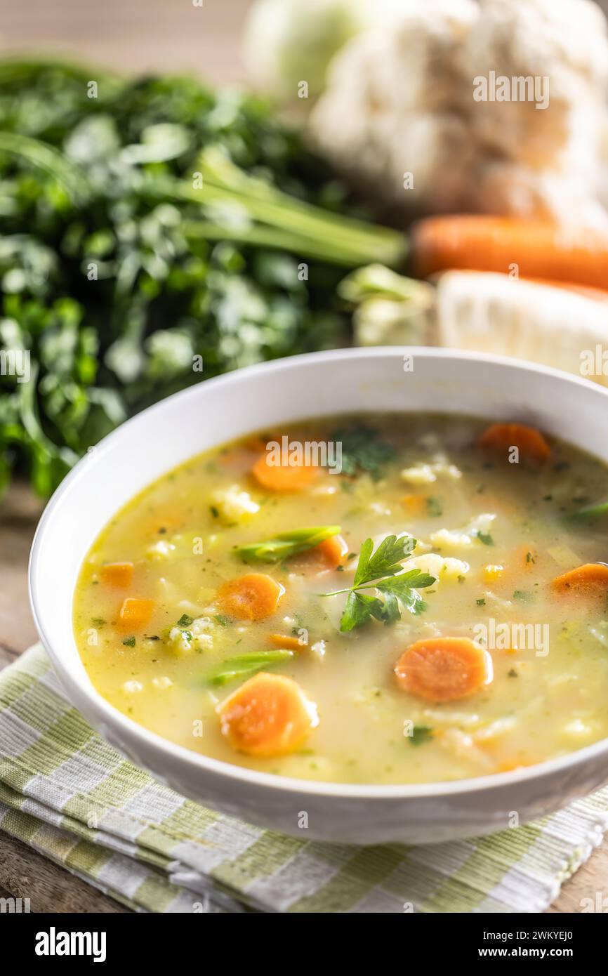Spring vegetable soup with chopped and grated root vegetables, seasoned ...