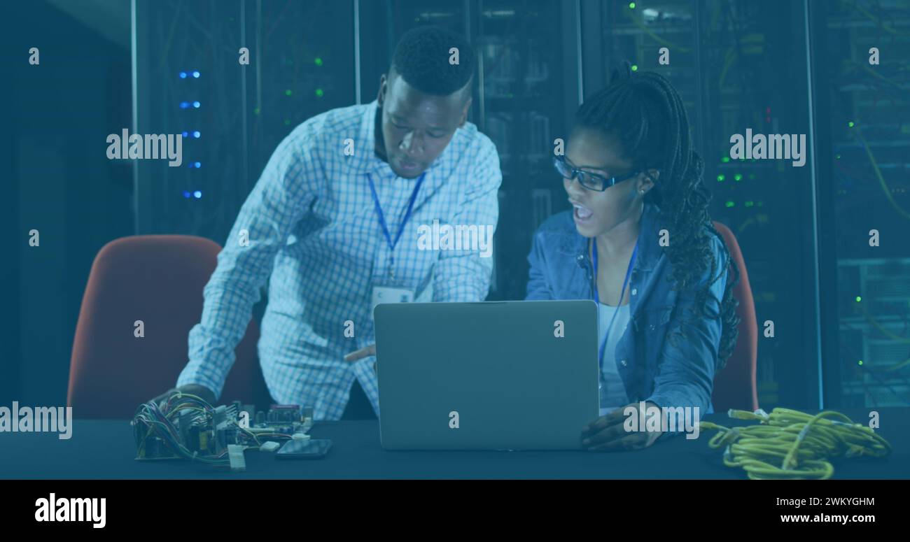 African american couple server room workers using headphones Stock ...