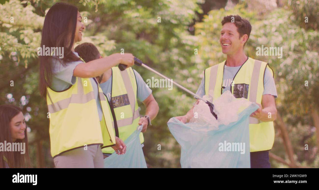 Volunteers clean up a park, with copy space Stock Photo - Alamy