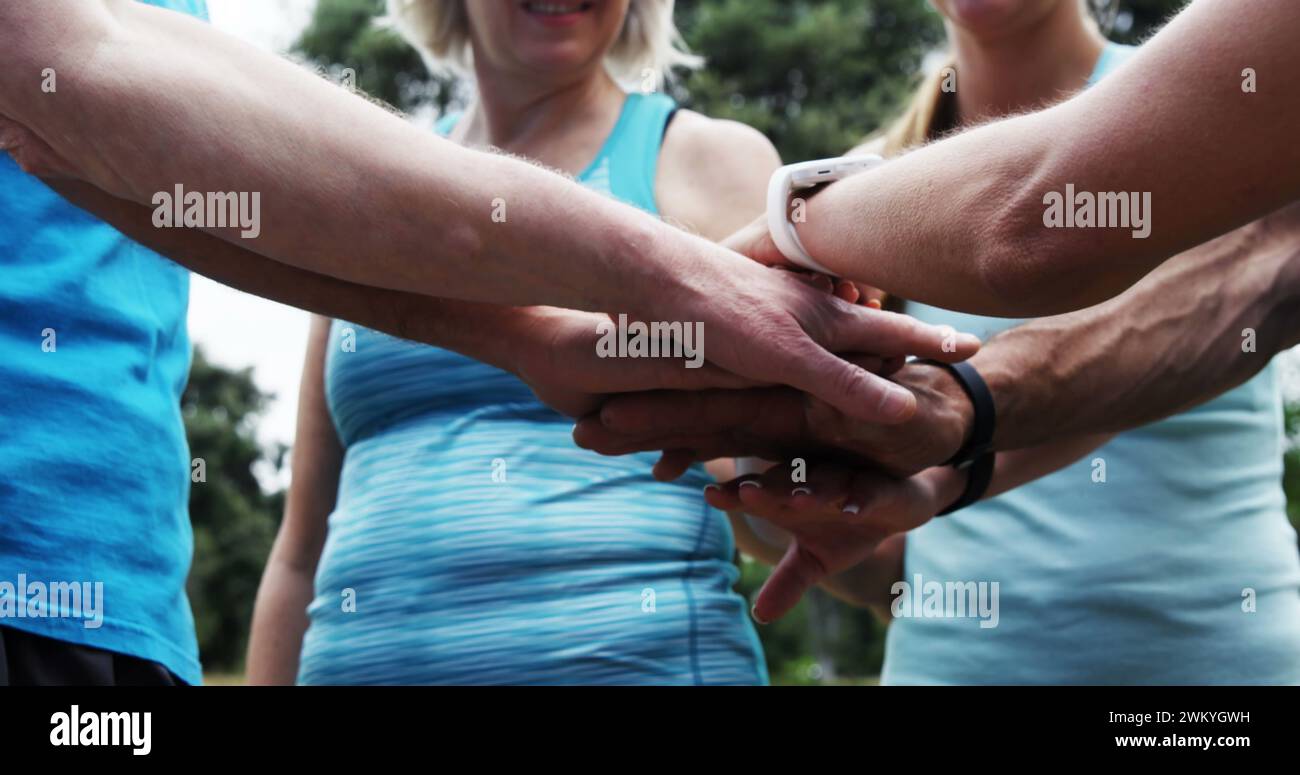 Team unity hands together hi-res stock photography and images - Alamy