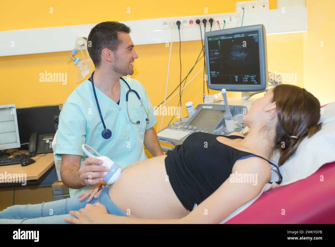 pregnant woman receiving ultrasound treatment in hospital Stock Photo ...