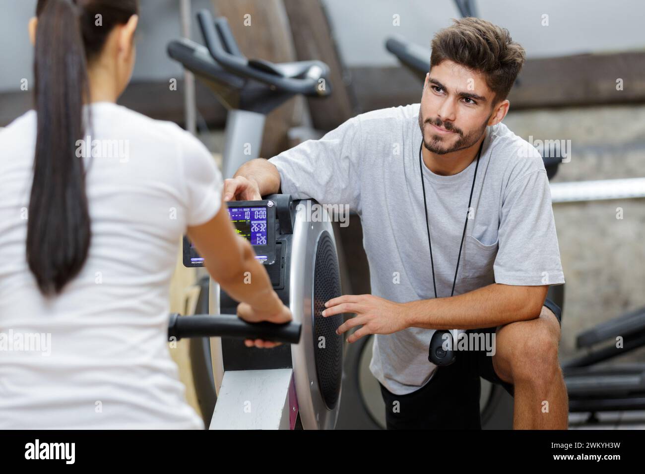 young asian adult woman exercising using rowing machine Stock Photo - Alamy